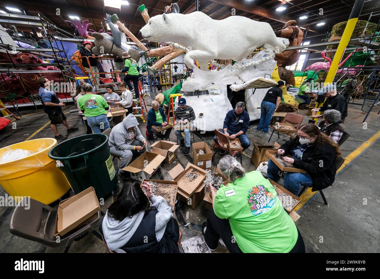 Volunteers work on a float for the 135th Rose Parade in Pasadena ...