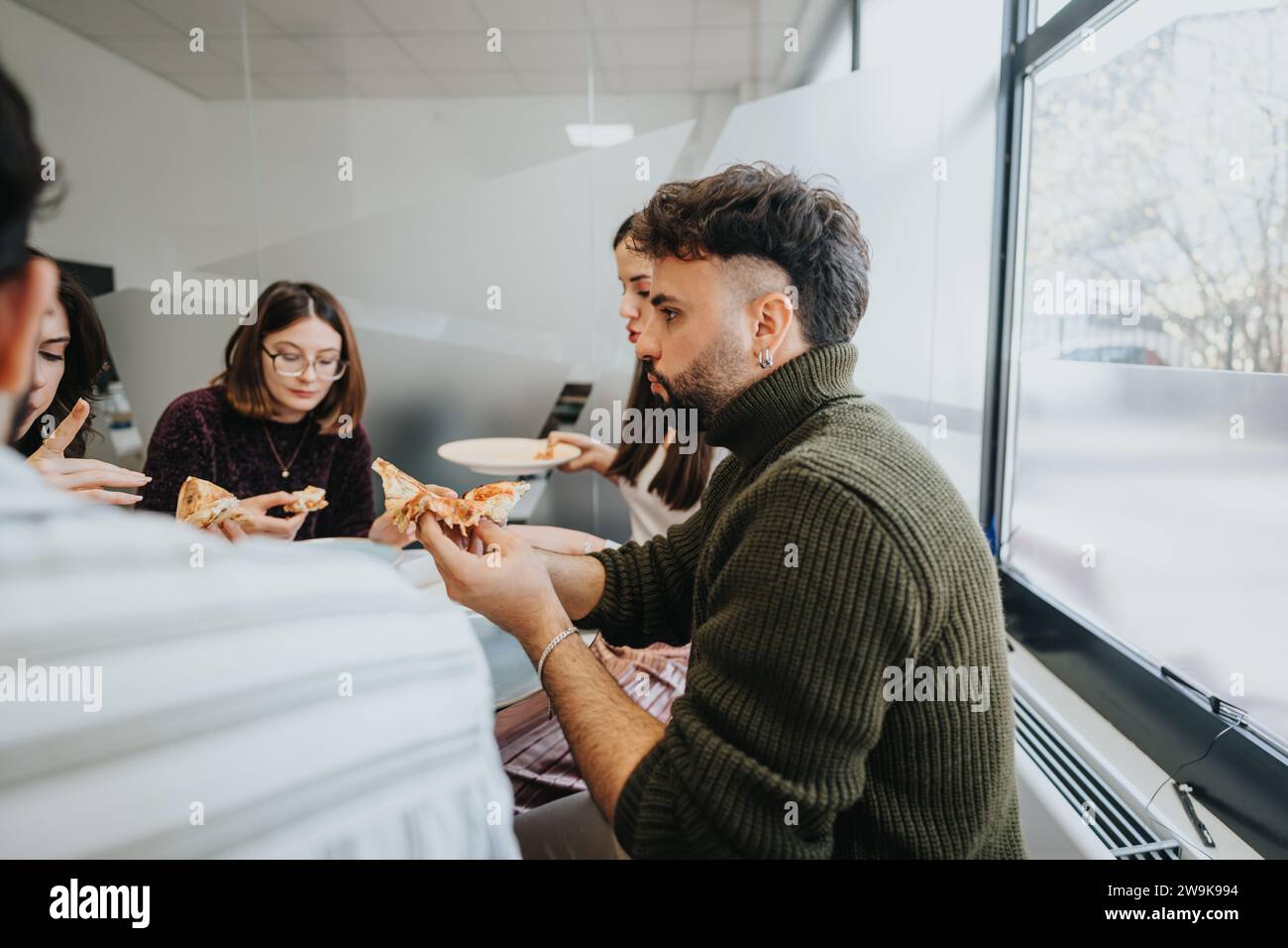 Successful business people enjoying a relaxing lunch break together ...
