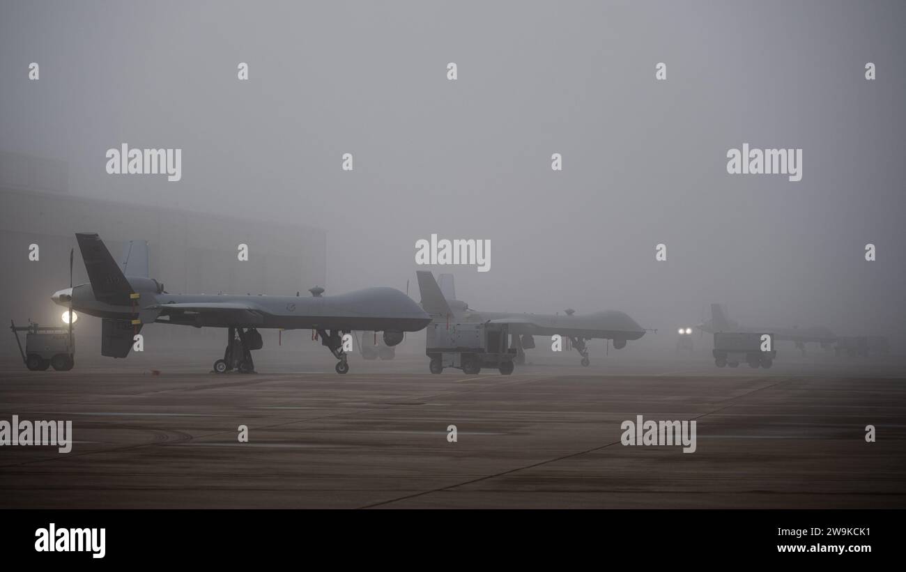 MQ-9 Reapers assigned to the 29th Attack Squadron sit on the flight ...