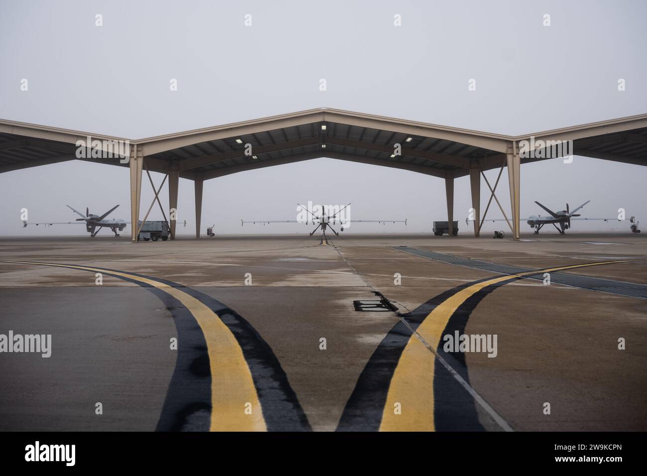 MQ-9 Reapers assigned to the 29th Attack Squadron sit on the flight ...