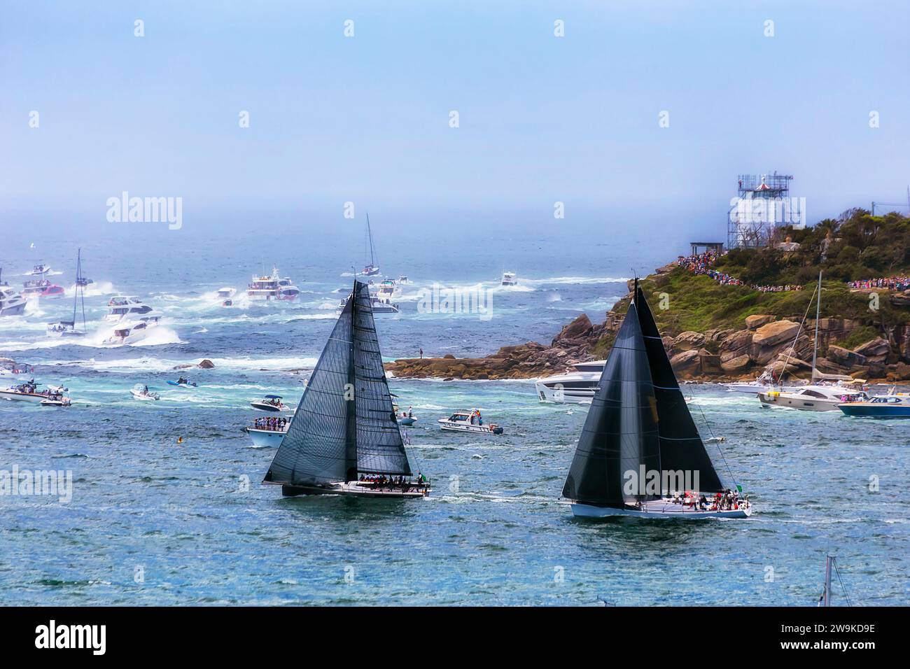 Maxi sailing yachts clearing Sydney harbour South Head in a race to ...