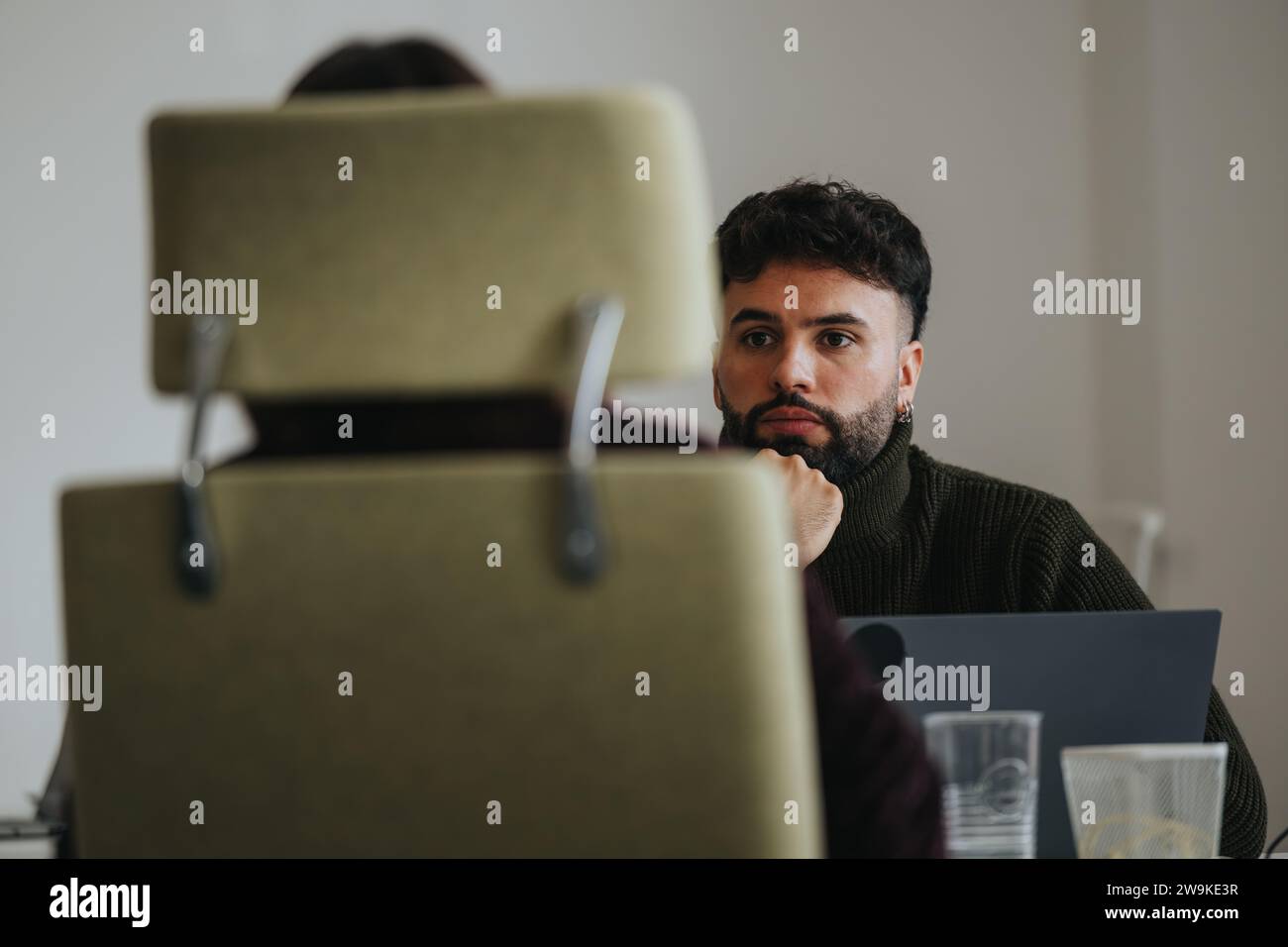 Multicultural people strategizing and collaborating in a modern office ...