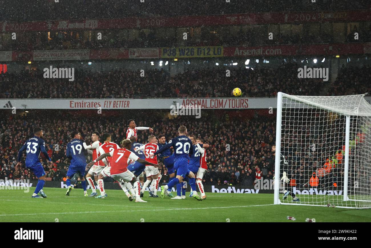 London, UK. 28th Dec, 2023. Konstantinos Mavropanos (WHU) heads the ...