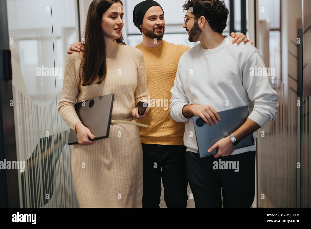 Cheerful businesspeople discussing and strategizing in a corporate ...