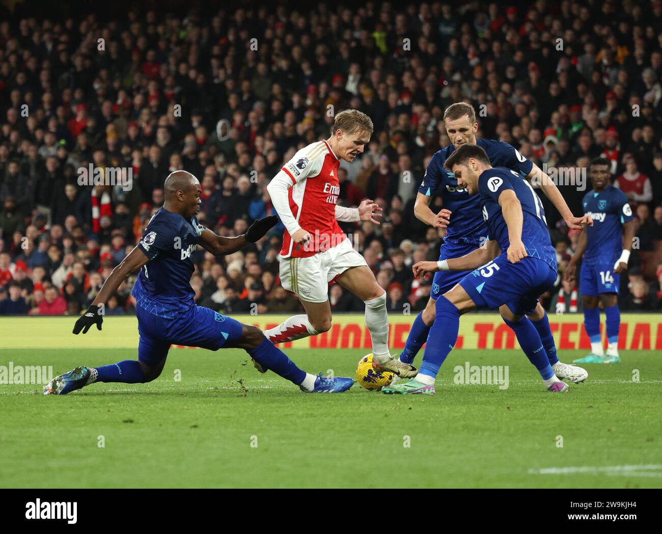 London, UK. 28th Dec, 2023. Angelo Ogbonna (WHU) Martin Odegaard (A ...
