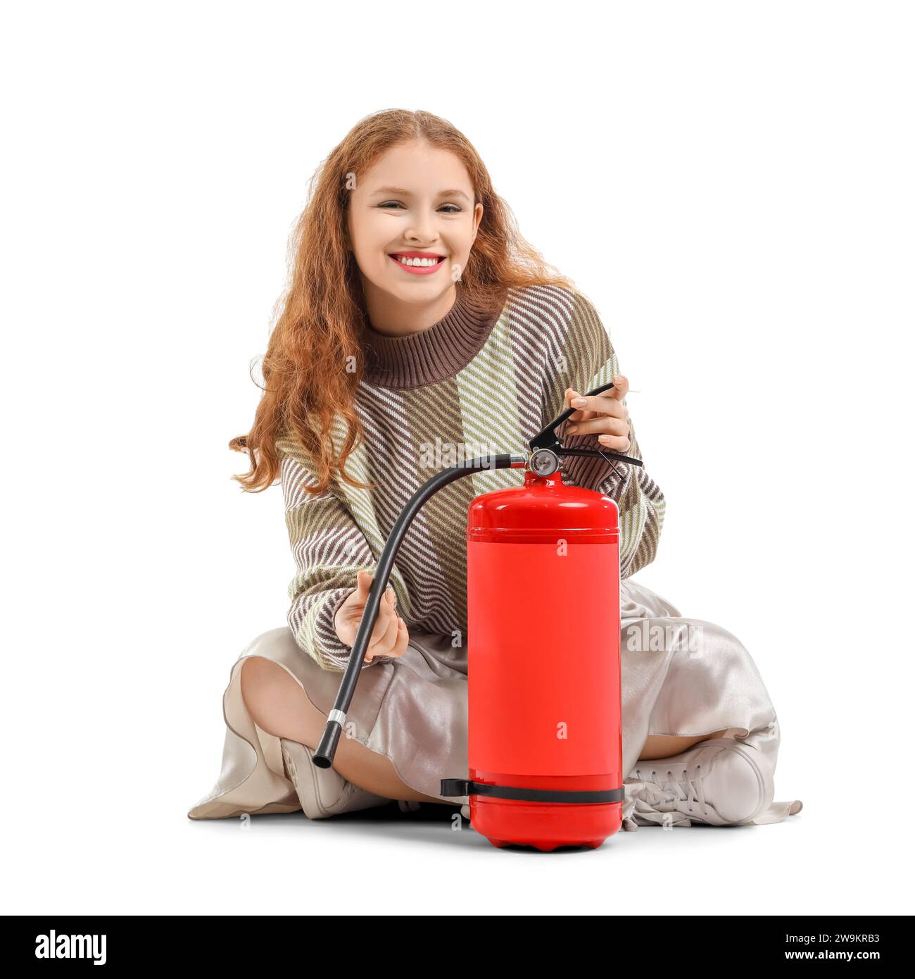 Young woman with fire extinguisher sitting on white background Stock ...