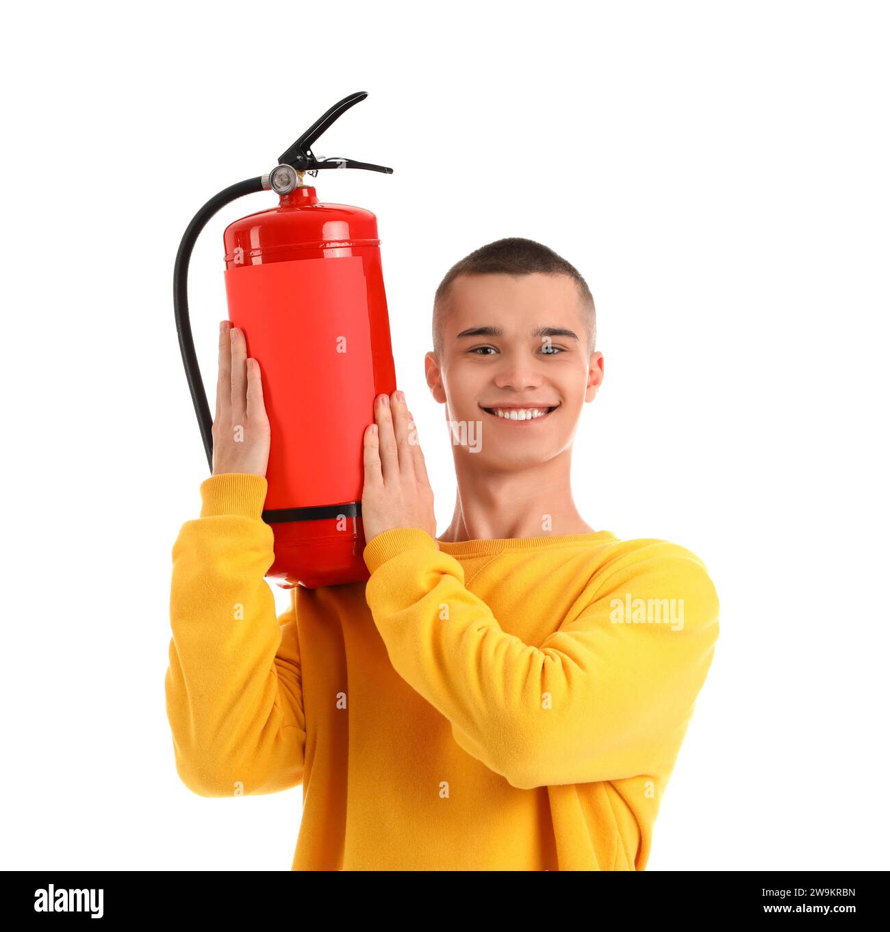 Teenage boy with fire extinguisher on white background Stock Photo - Alamy