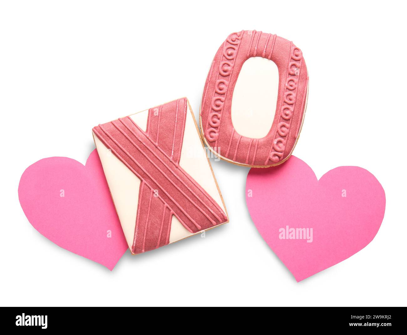 Sweet cookies in shape of XO symbol and paper hearts on white ...