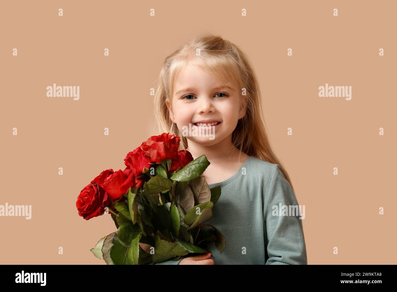 Cute little girl with red roses on beige background. Valentines Day ...
