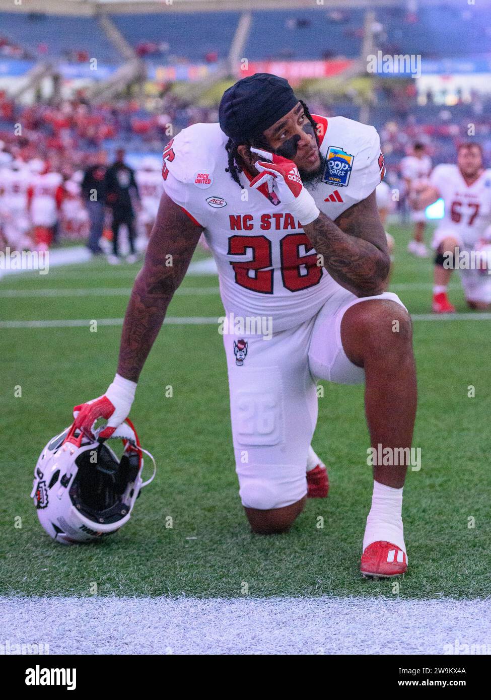 Orlando, FL, USA. 28th Dec, 2023. NC State linebacker Devon Betty (26 ...