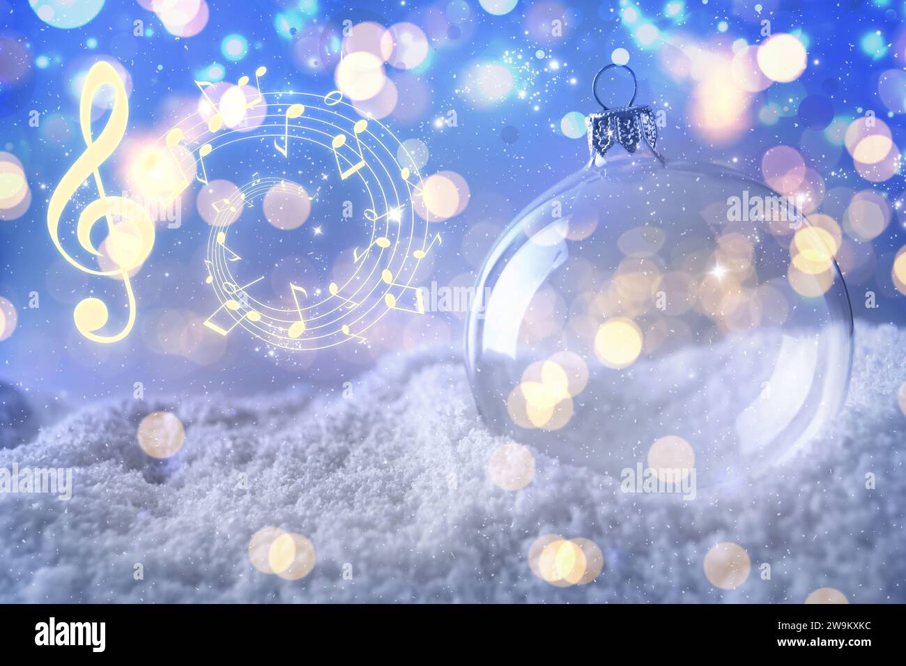 Music notes and Christmas ball on snow, bokeh effect Stock Photo - Alamy