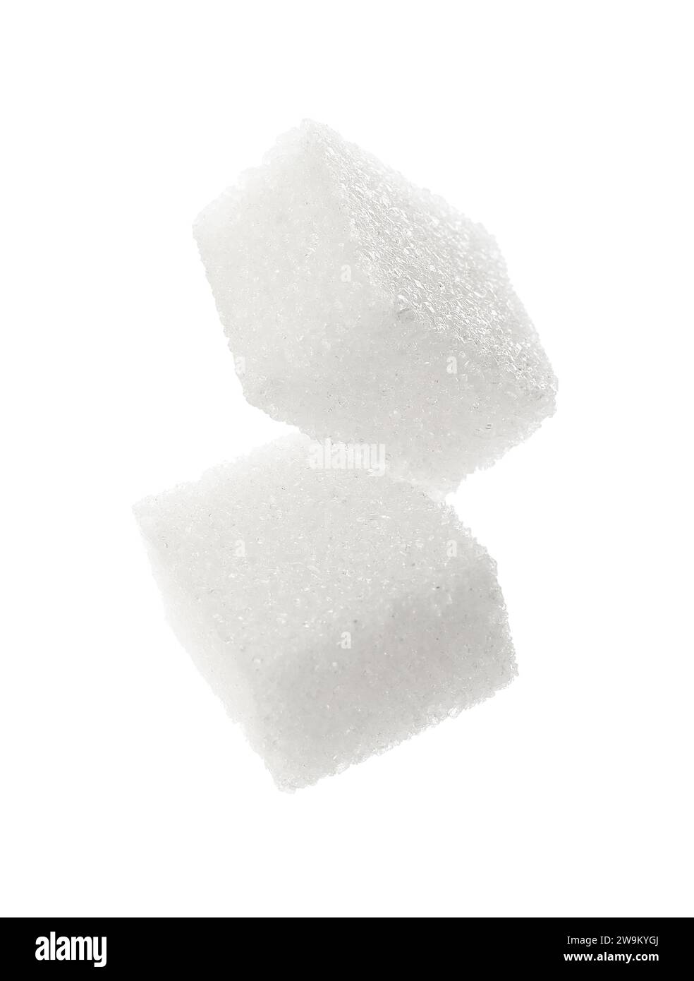 Cubes of sugar falling on white background Stock Photo - Alamy