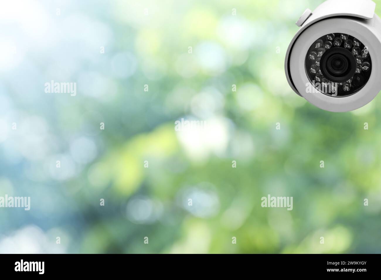 Modern security CCTV camera outdoors, space for text Stock Photo - Alamy