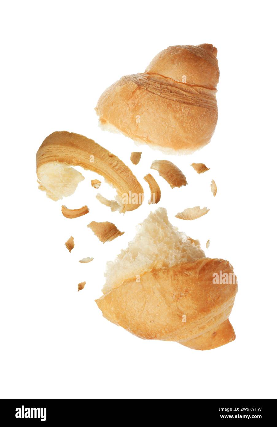Pieces of delicious fresh croissant falling on white background Stock ...