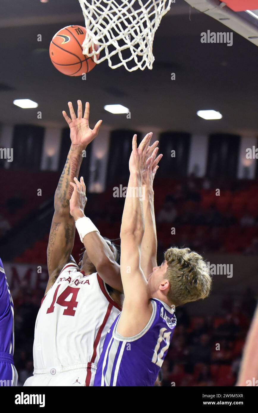 Oklahoma forward Jalon Moore (14) shoots over Central Arkansas forward ...