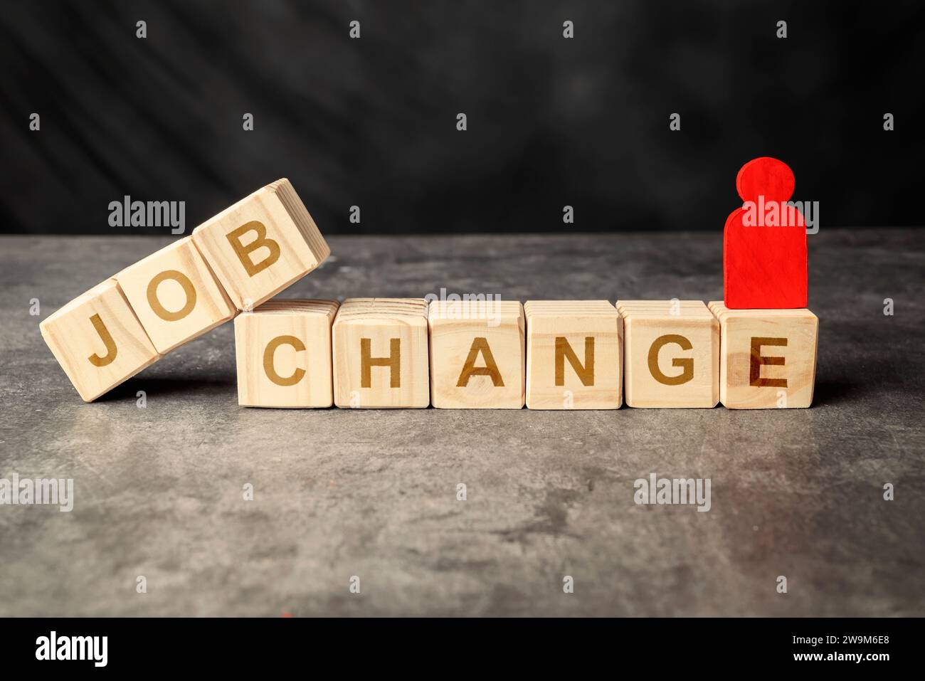 Wooden figures and cube with JOB CHANGE letter. Career growth concept ...