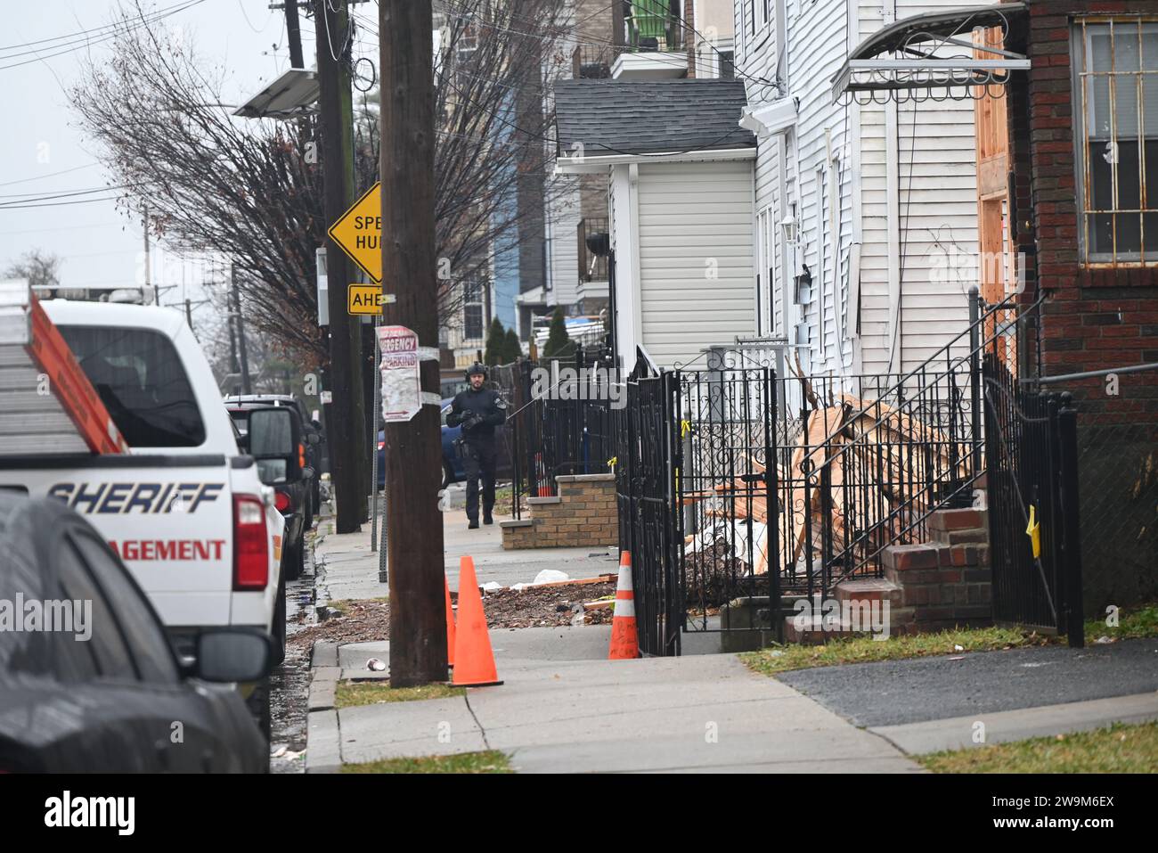 Newark, United States. 28th Dec, 2023. SWAT officers rush out of the ...
