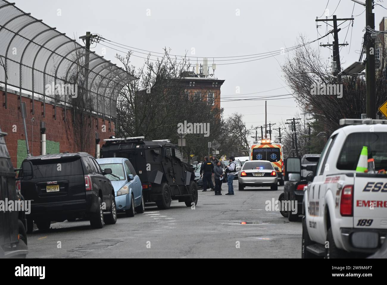 Newark, United States. 28th Dec, 2023. SWAT officers rush out of the ...