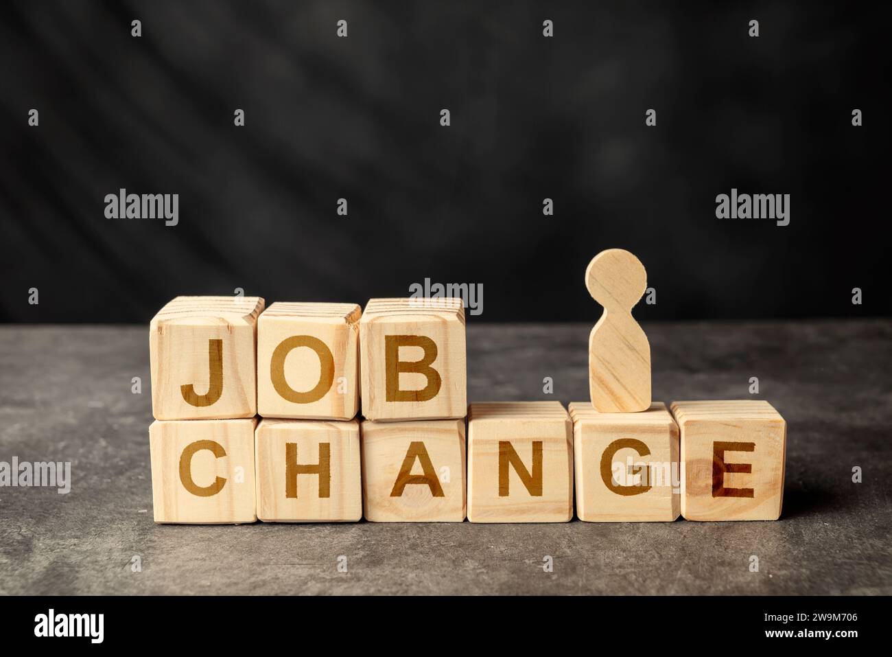 Wooden figures and cube with JOB CHANGE letter. Career growth concept ...