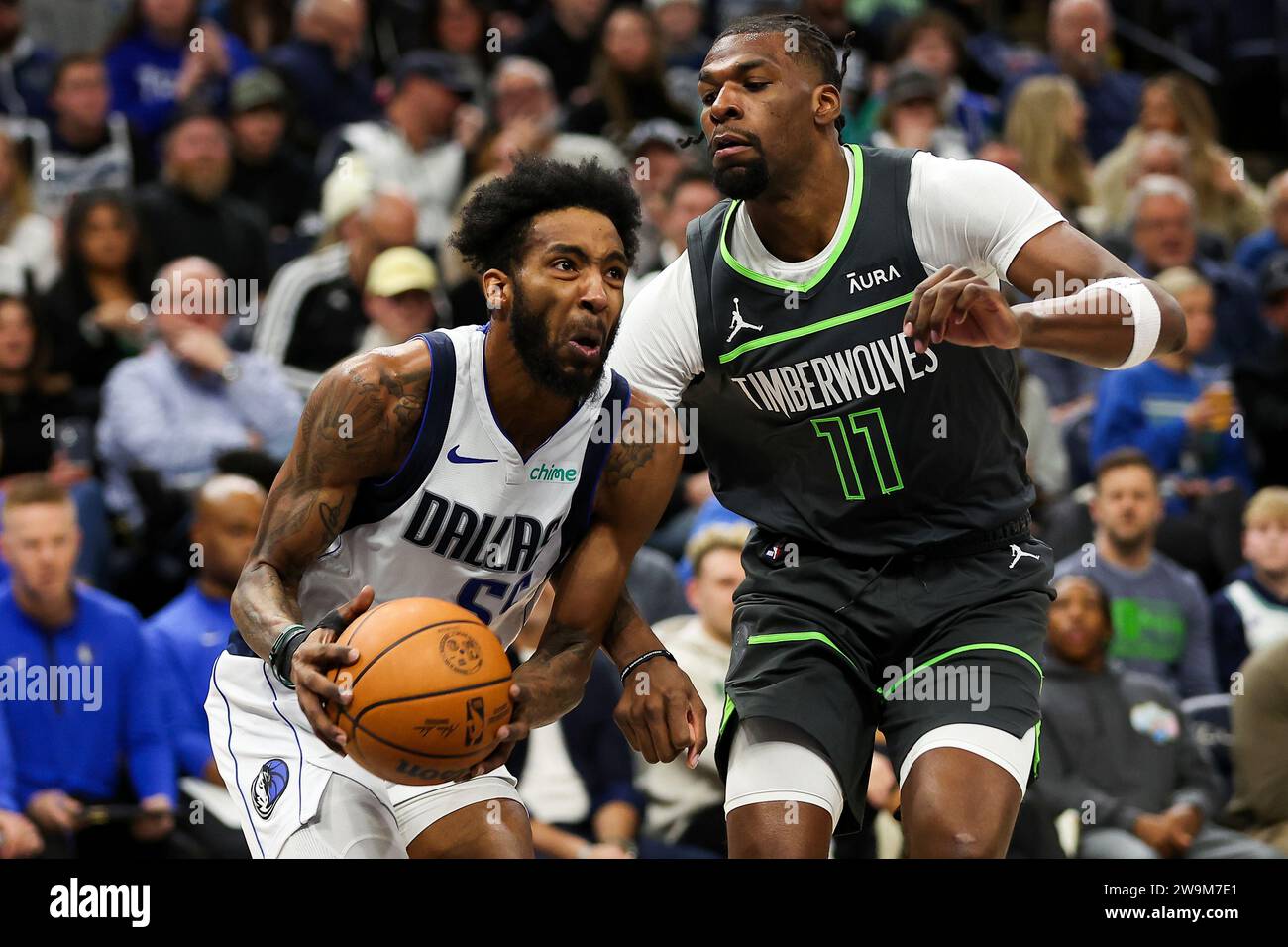 Dallas Mavericks forward Derrick Jones Jr., left, works toward the ...