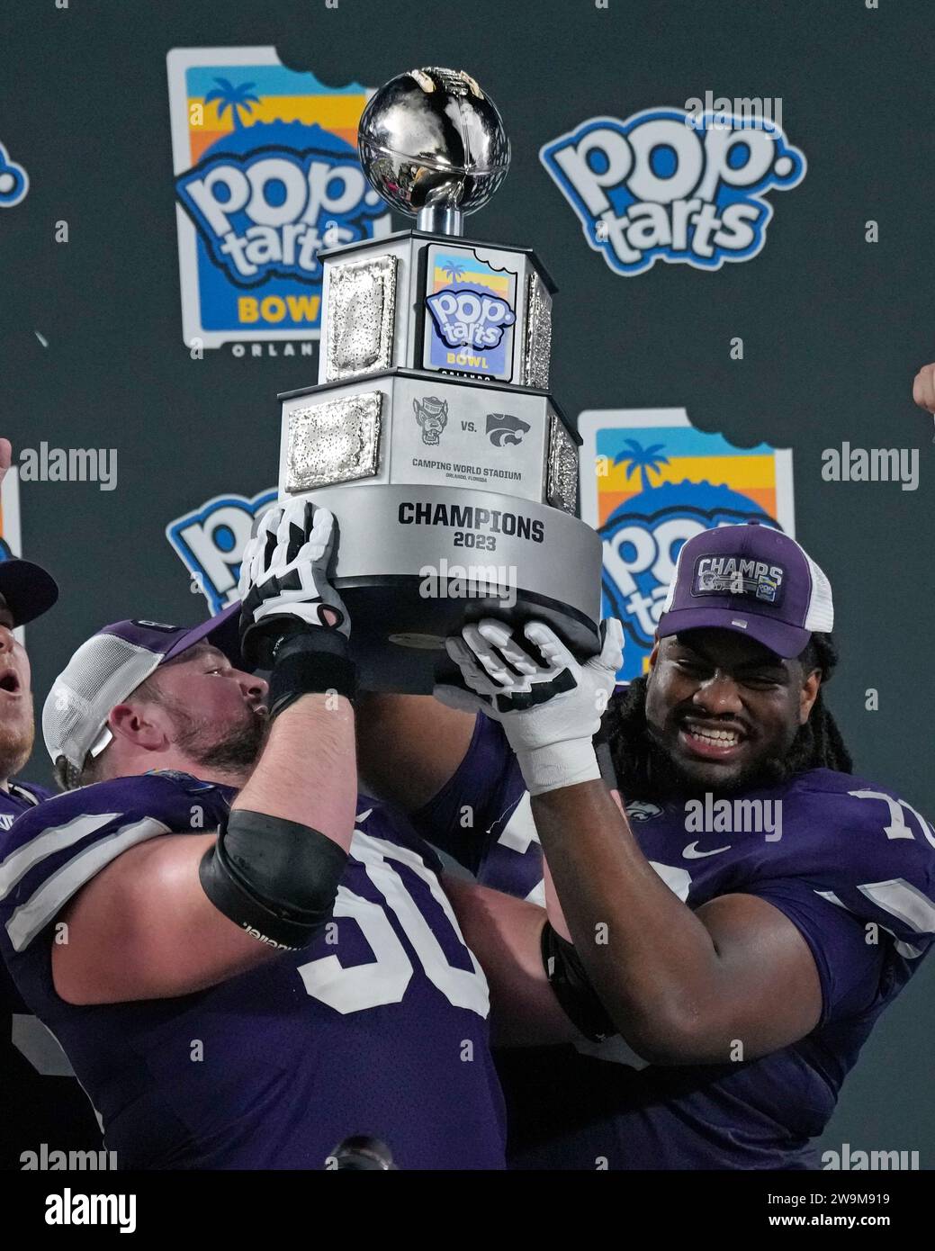 Kansas State offensive lineman Cooper Beebe, left, and offensive ...