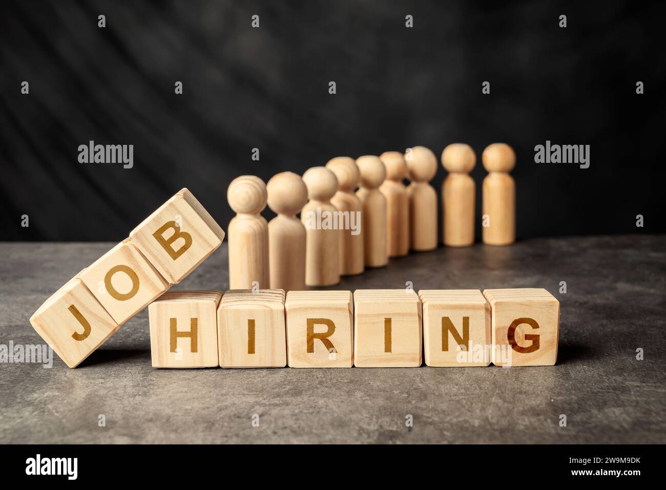 Wooden figures and cubes with JOB HIRING letter. Human resources ...