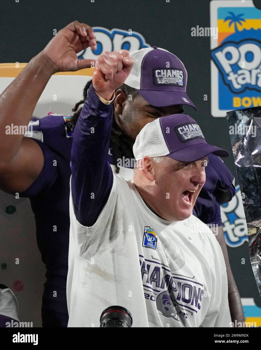 Kansas State head coach Chris Klieman cheers with players after ...