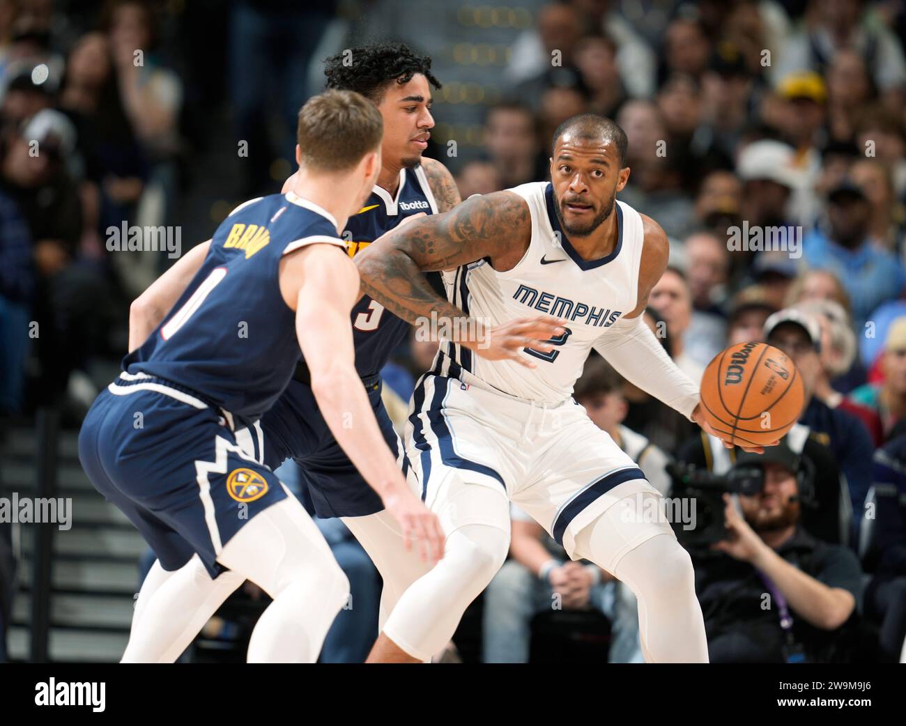 Memphis Grizzlies forward Xavier Tillman, right, is trapped with the ...