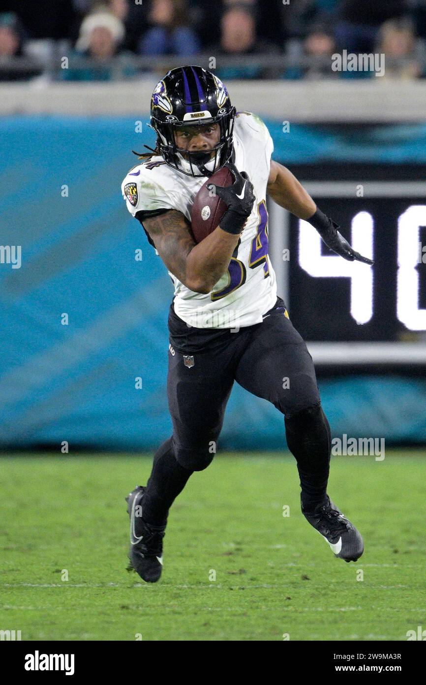 Baltimore Ravens running back Keaton Mitchell (34) rushes for yardage ...