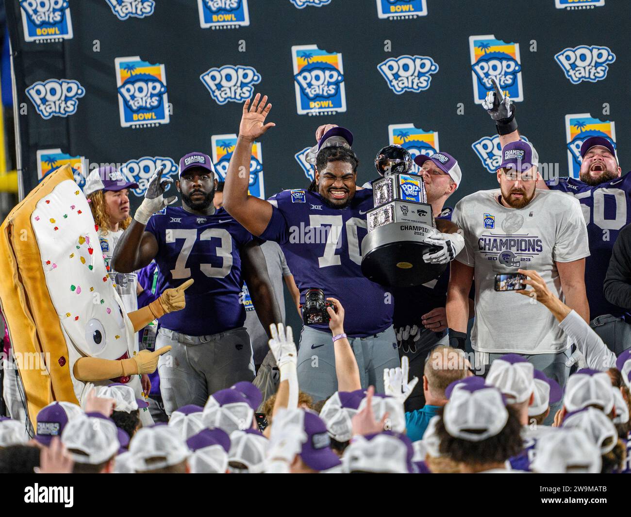 December 28, 2023: Kansas State offensive lineman KT Leveston (70) hugs ...