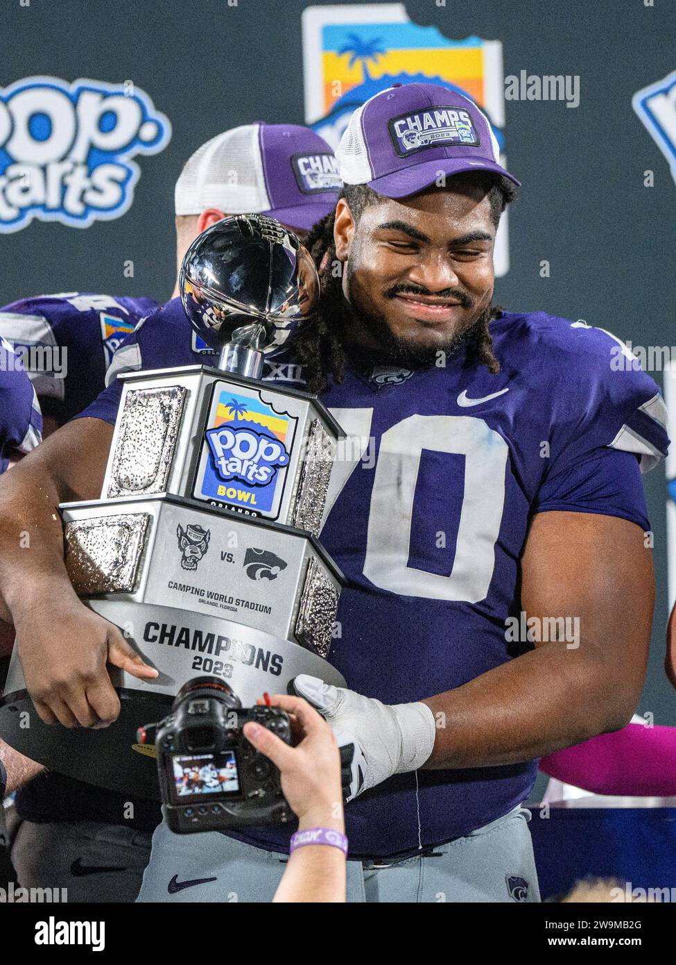 December 28, 2023: Kansas State offensive lineman KT Leveston (70) hugs ...