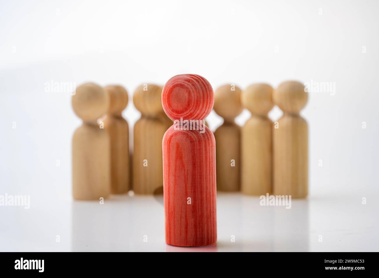 Closeup view row of wooden figure isolated over white background Stock ...