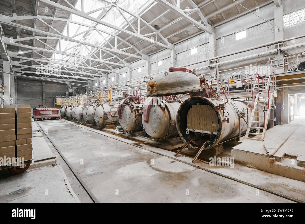 Raw bricks loaded into open autoclave for hardening in shop Stock Photo ...