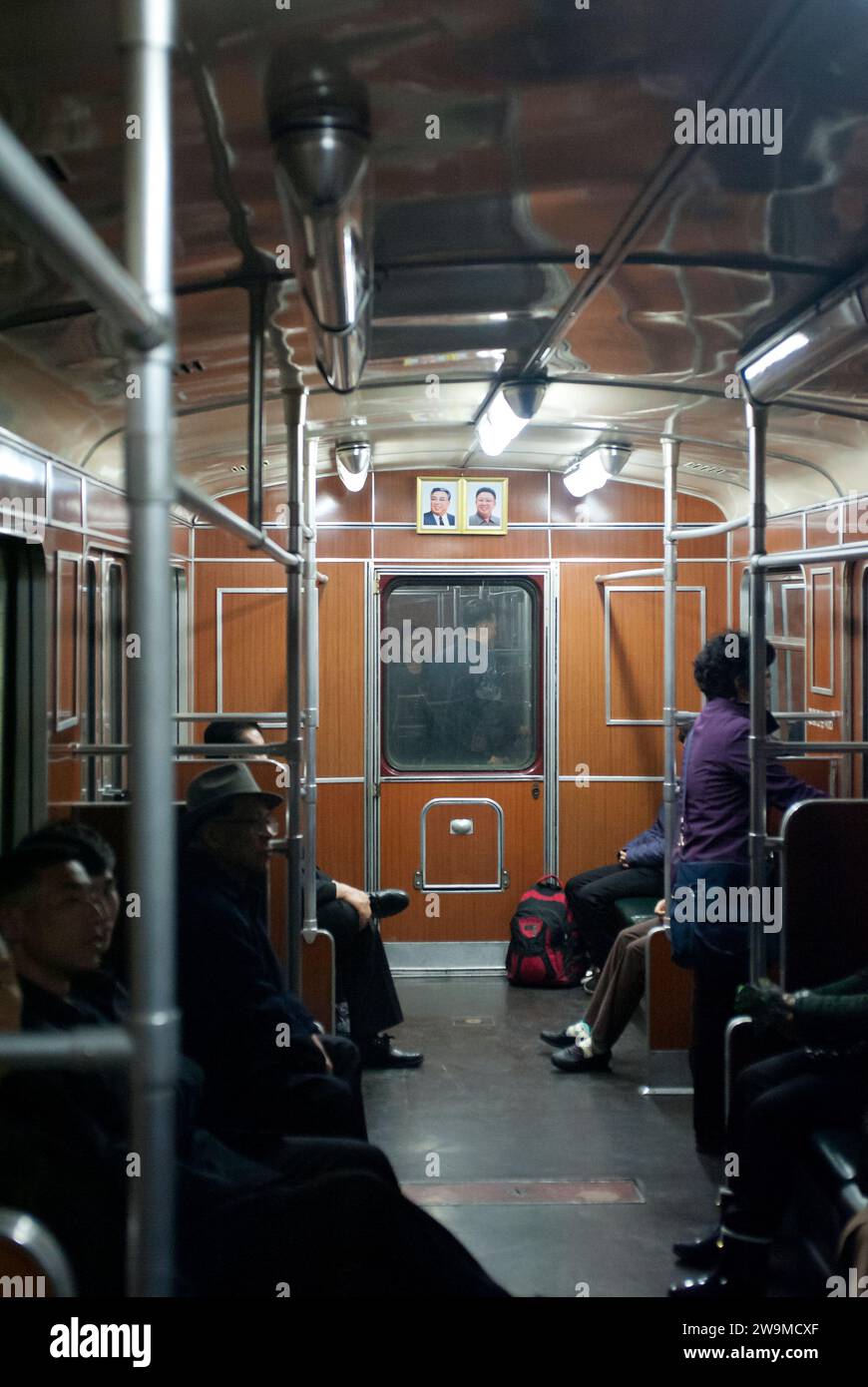 Portraits of Kim il-Sung and Kim Jong-il in a train carriage on the ...