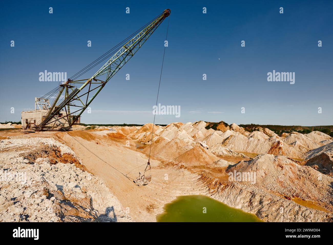 Old dragline mines minerals in chalk quarry on sunny day Stock Photo ...