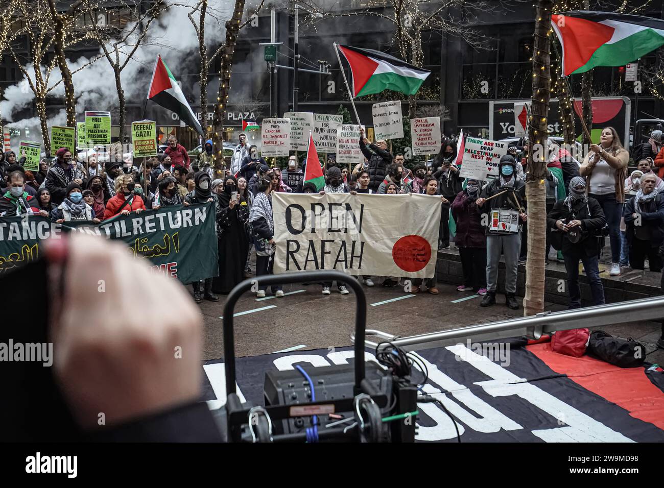People hold banners and wave flags during the demonstration. On ...