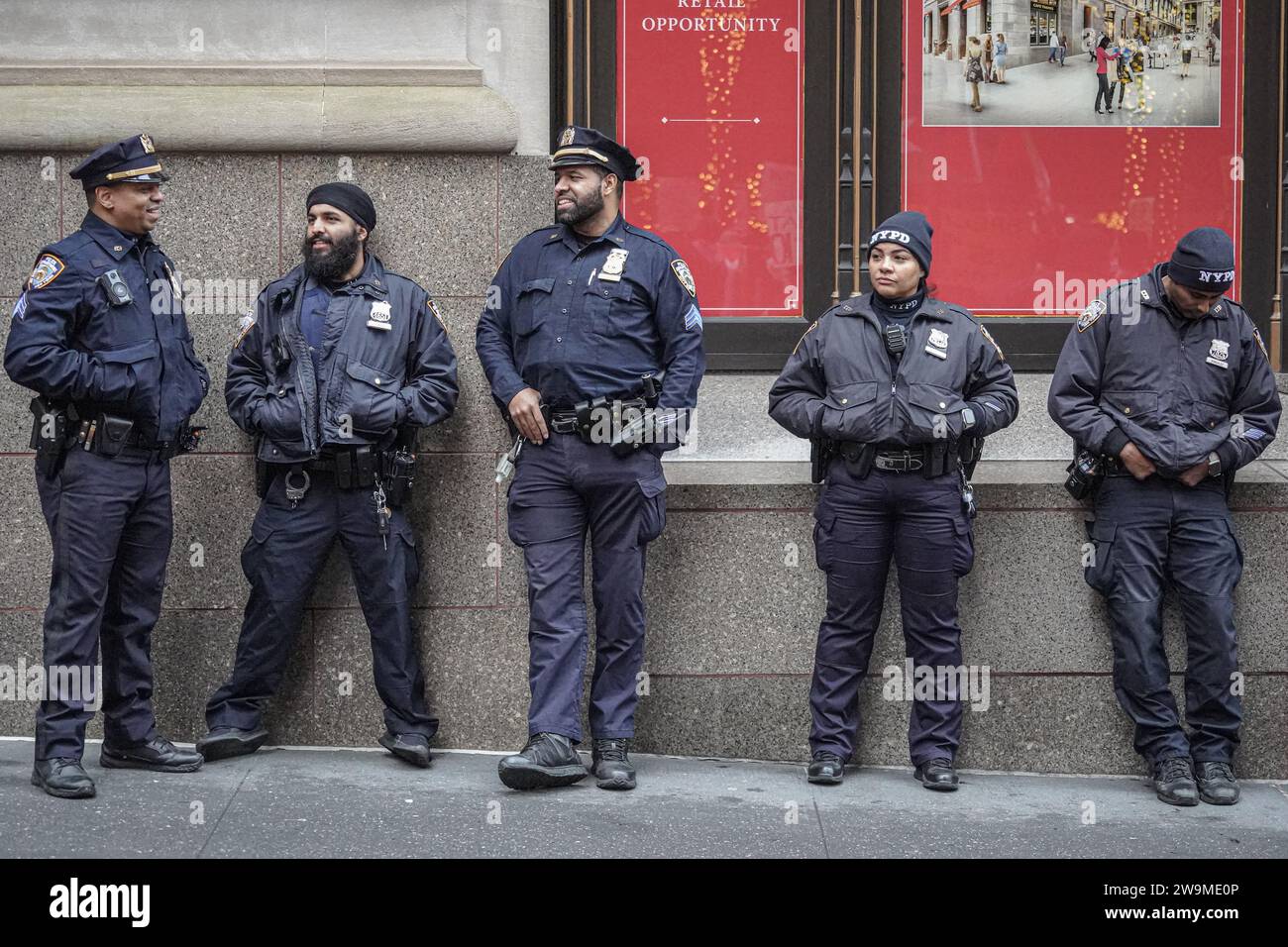 Police officers from the New York Police Department(NYPD) stand on the ...
