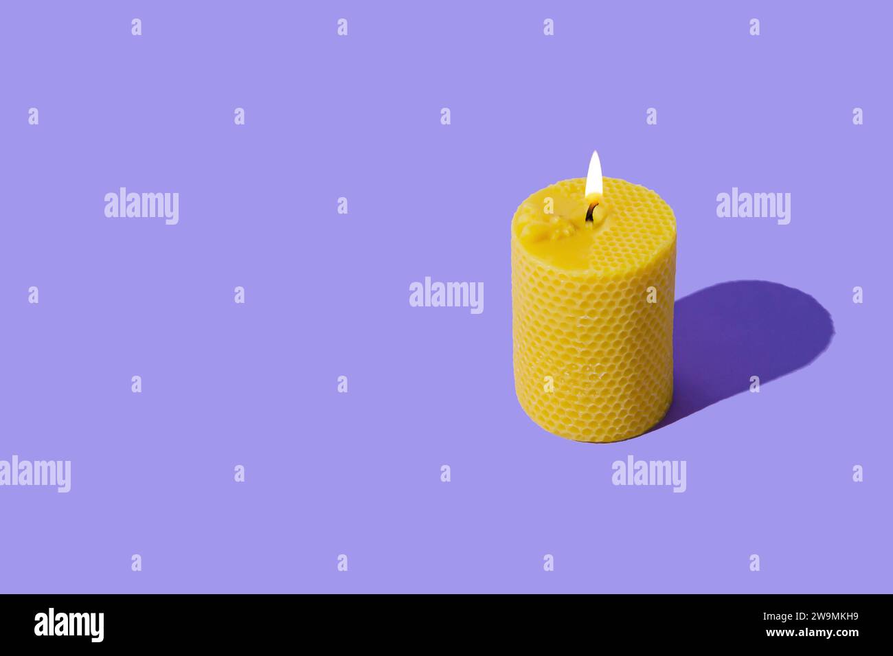 Creative layout of beeswax candle made with natural wax produced by ...