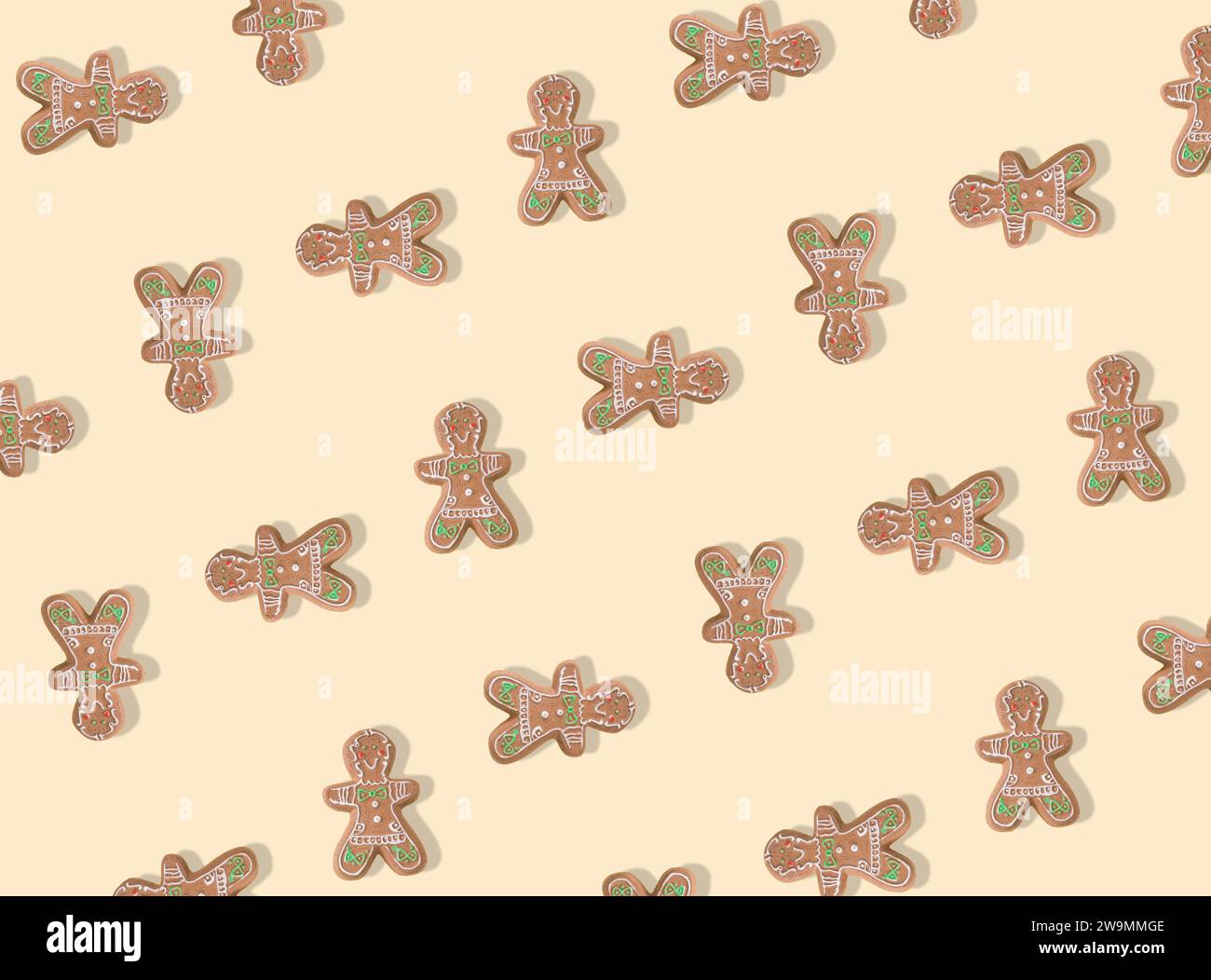 Trendy pattern made of gingerbread Christmas tree decoration on pastel ...