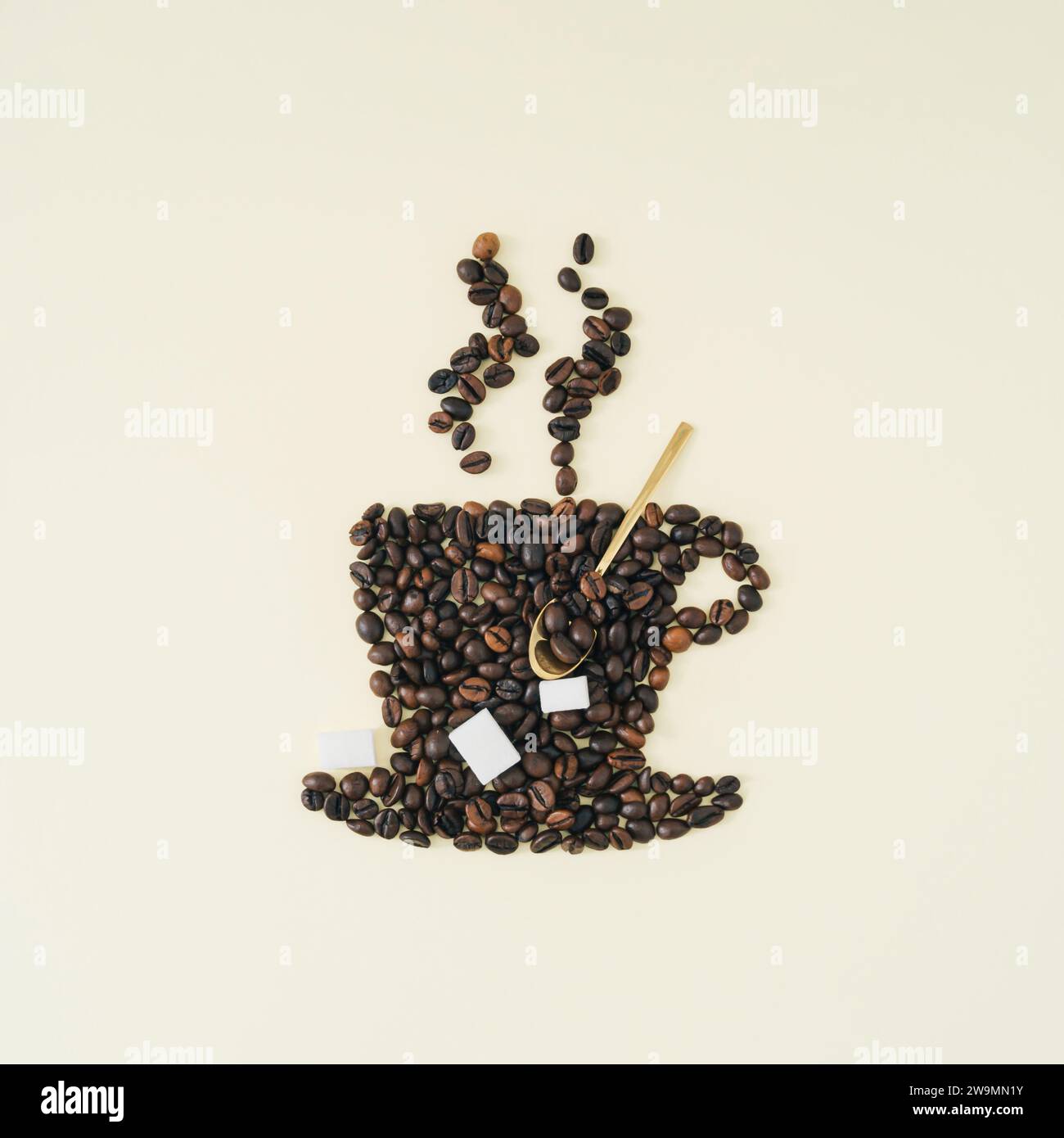 Creative composition of steaming cup of coffee shape made of roasted ...