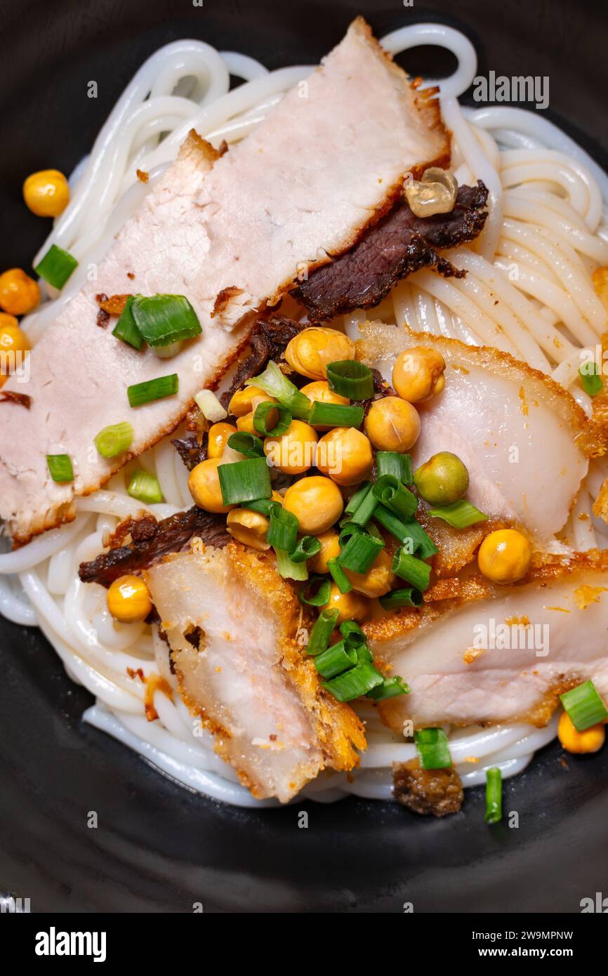 top view fresh guilin rice noodles with roasted pork at vertical ...