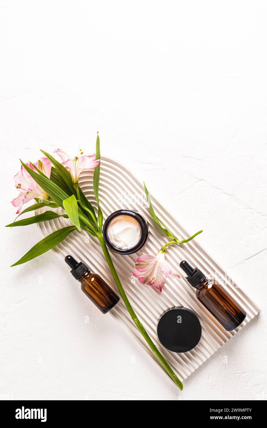 A set of cosmetics for face and body skin care in various bottles on a ...