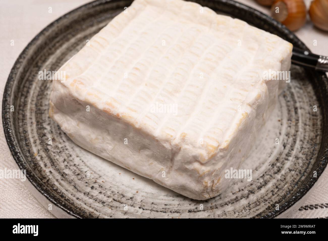 French squared pont l'eveque cow cheese from Calvados department, close ...
