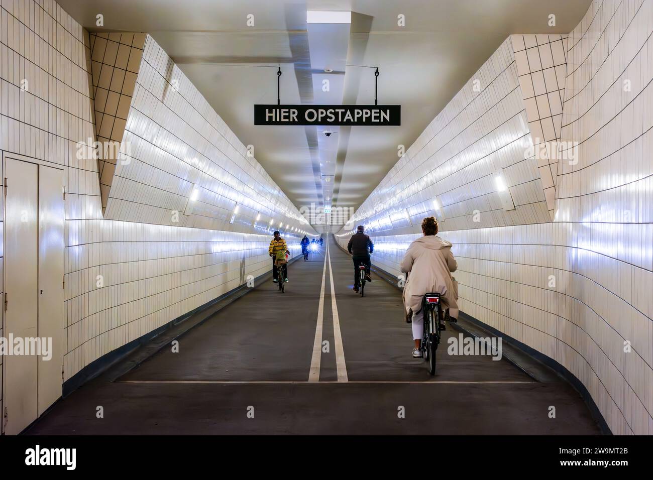 Cyclists take the bicycle path of the Maastunnel, a 500-meter long ...