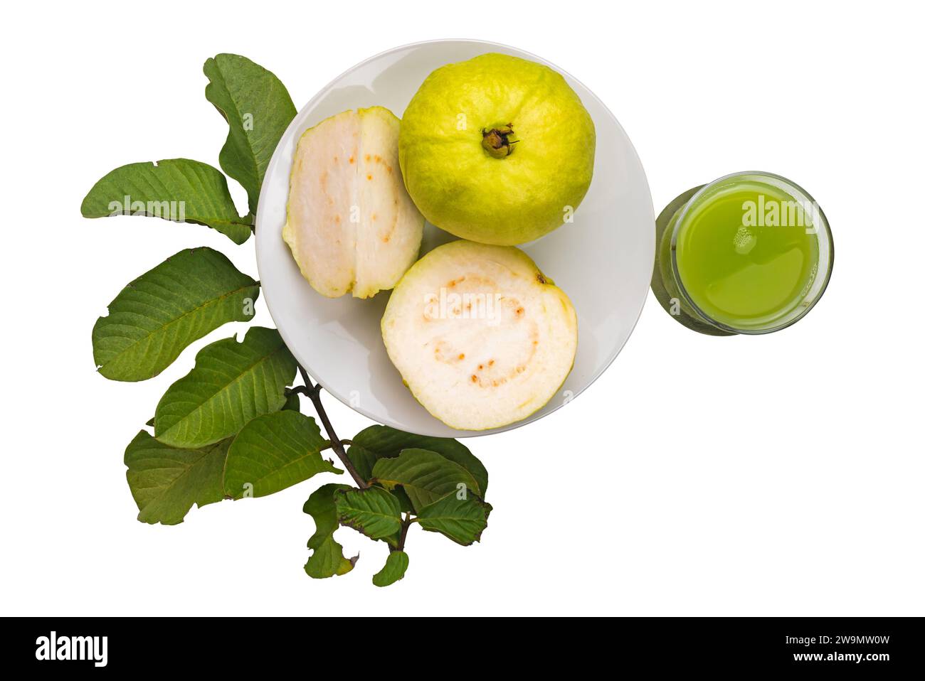 Top view of fresh guava juice in transparent glass with ripe guava ...