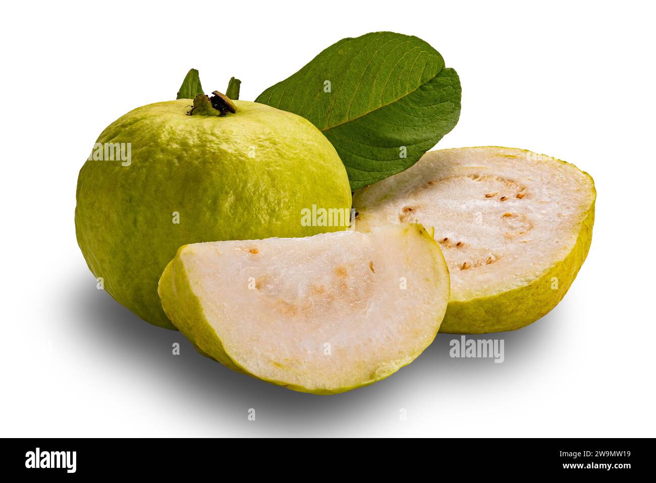 Side view of fresh guava fruit whole and half with green guava leaf ...
