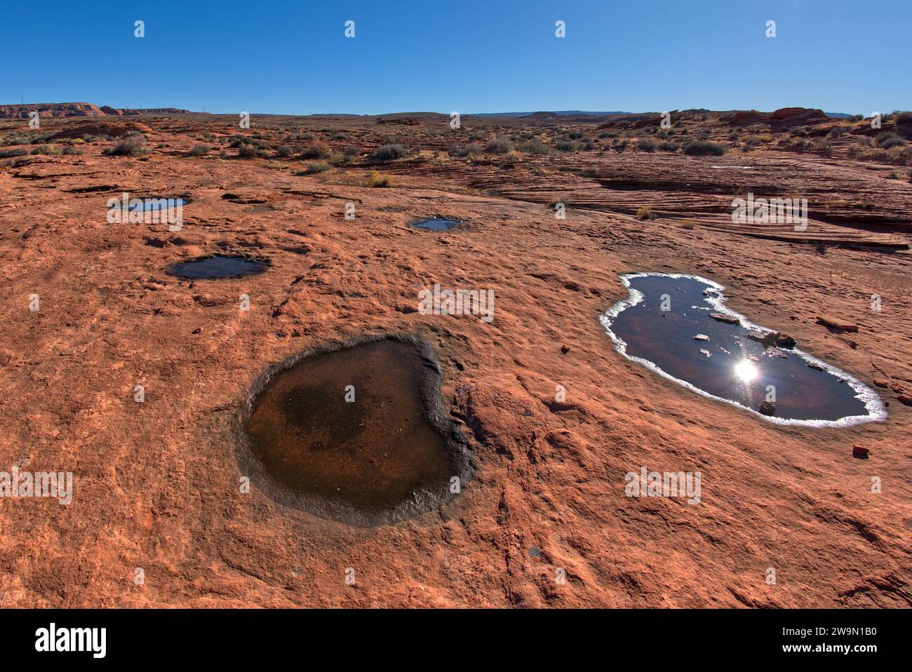 Reflecting Pools of water in the badlands of Horseshoe Bend near Page ...