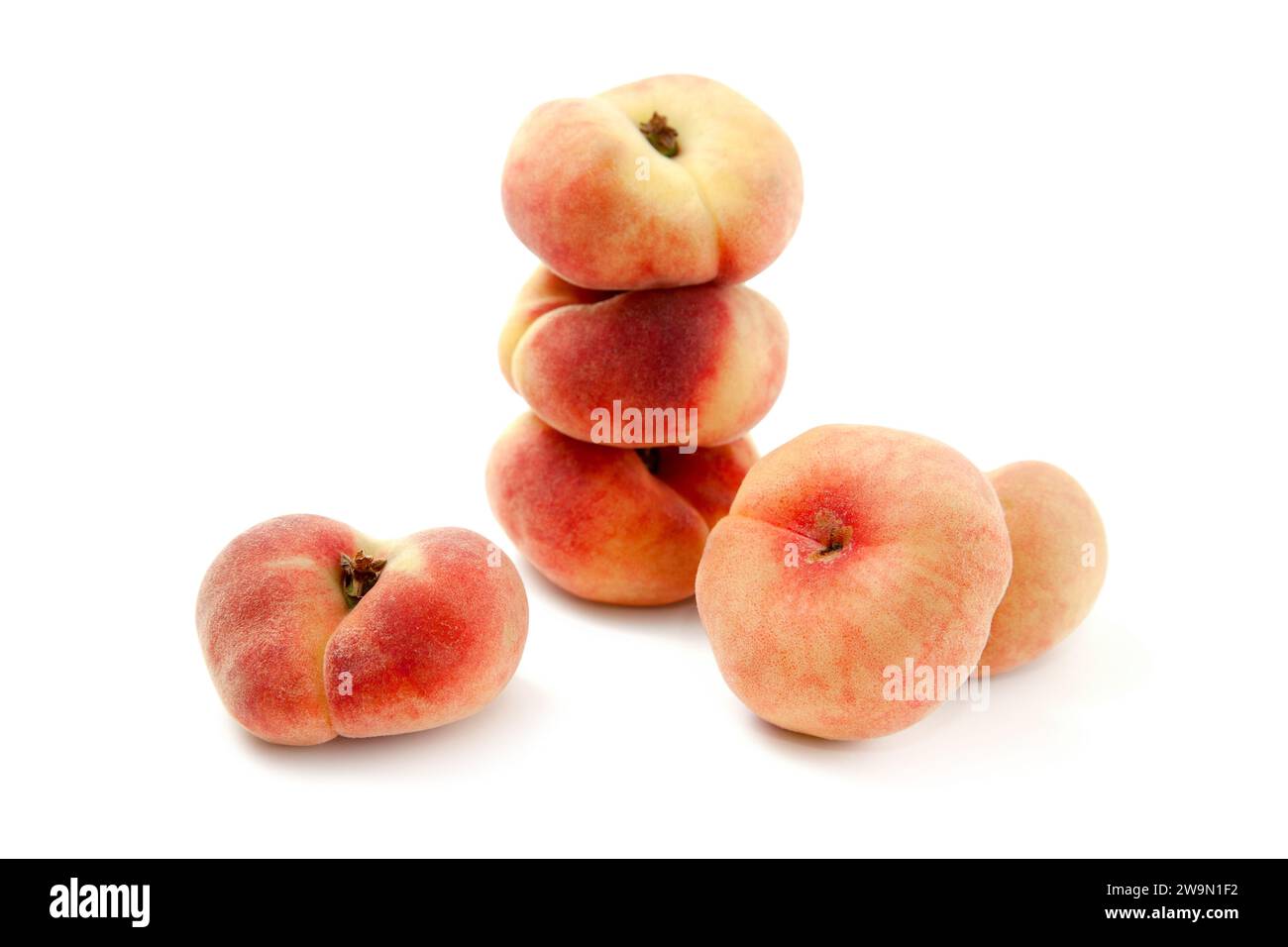 Several ripe chinese flat peach fruits or saturn peaches with soft ...