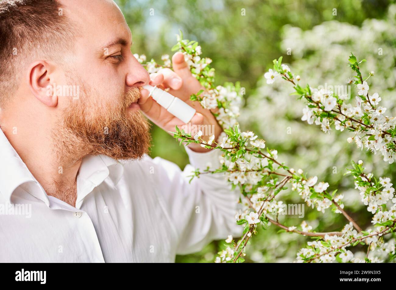 Man allergic using medical nasal drops, suffering from seasonal allergy ...