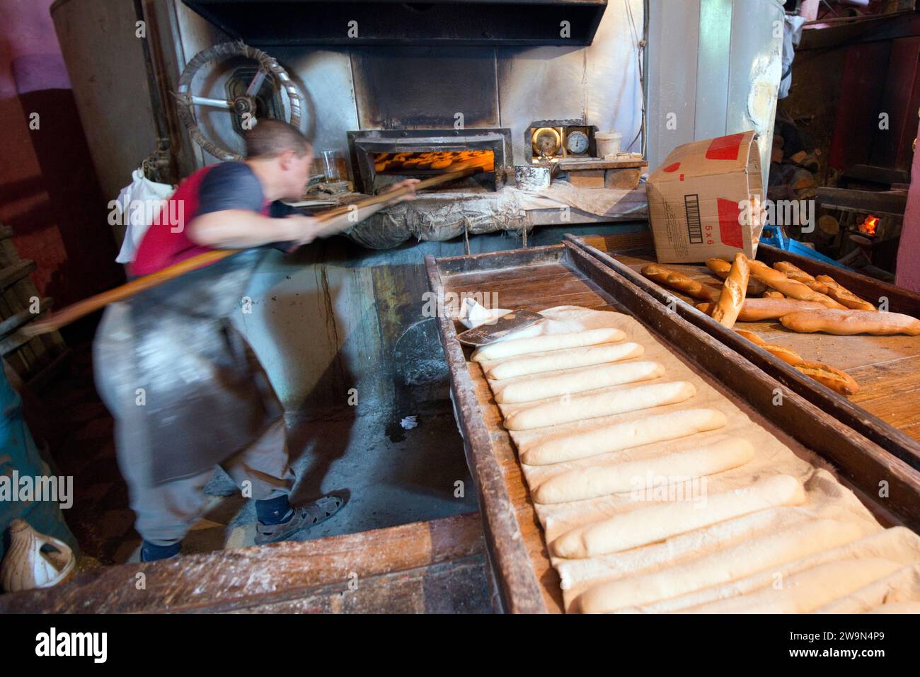 A man bakes bread in one of the many public ovens in Tangier, Morocco ...